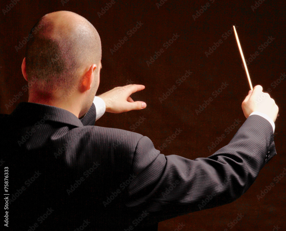 Concert conductor with baton isolated on black background, back Stock ...