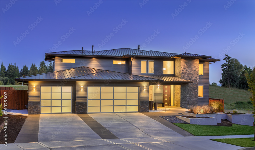 Front elevation of luxury home in evening Stock Photo | Adobe Stock