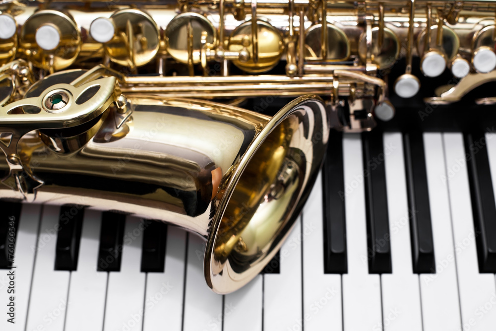 Poster Fragment of the saxophone lying on the piano keys – Wall Art ...