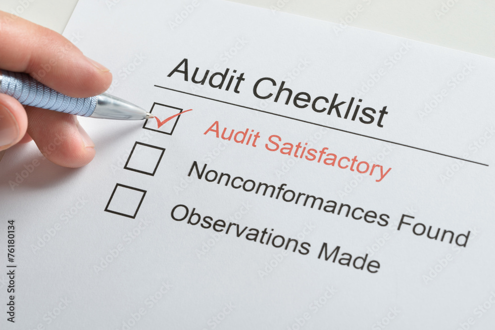 Person Hand Making Tick In Audit Checklist foto de Stock | Adobe Stock