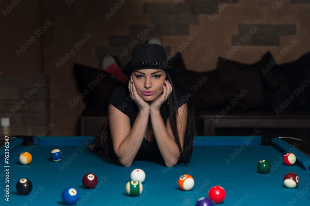 Young Woman Lying On The Billiard Table Stock Photo | Adobe Stock