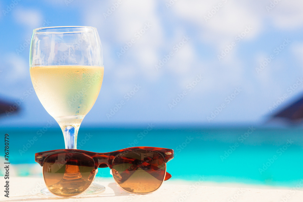 glass of chilled white wine and sunglasses on table near the Stock-Foto ...
