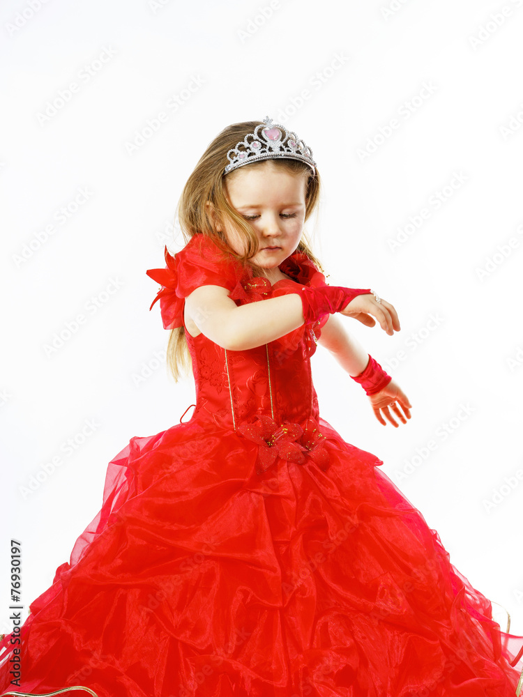 Cute little princess dressed in red with crown on her head posi Stock ...