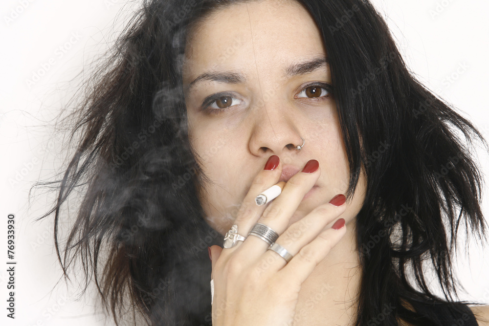 Sexy black hair woman smoking a cigarette Stock Photo | Adobe Stock