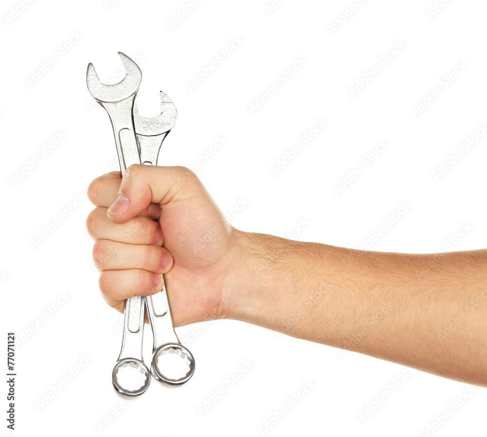 Metal wrenches in male hand isolated on white Stock Photo | Adobe Stock