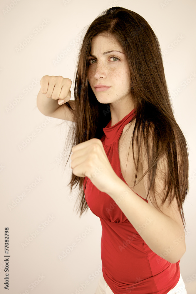 Angry woman ready to punch and kick ass Stock Photo | Adobe Stock
