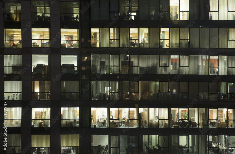 Office building at night ภาพถ่ายสต็อก | Adobe Stock