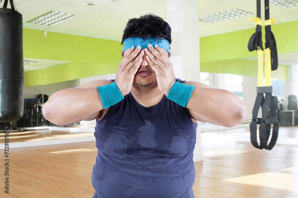 Fat man tired after workout Stock Photo | Adobe Stock