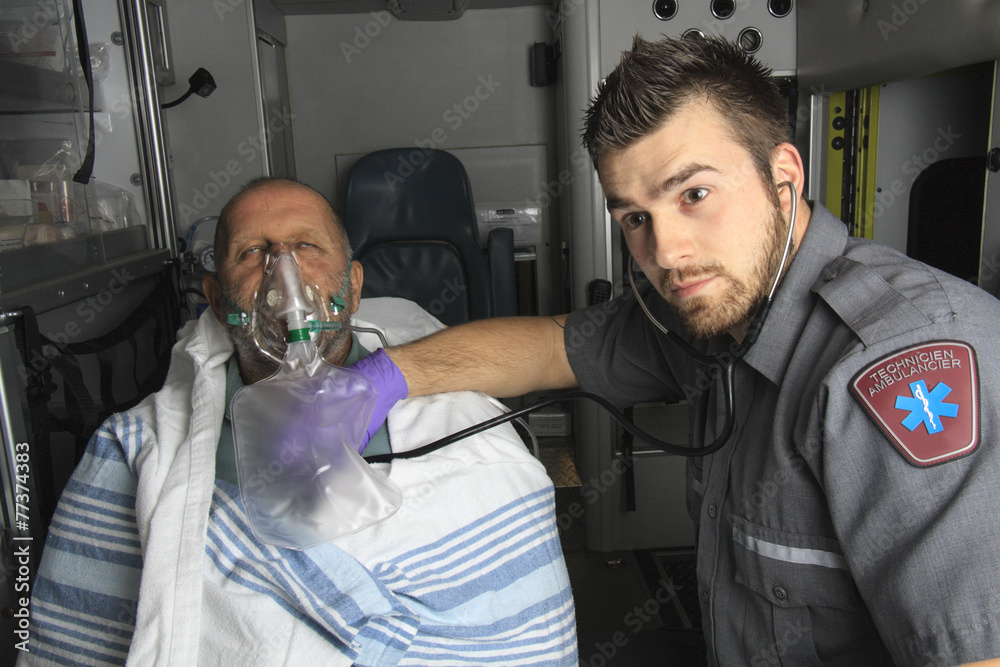 professional paramedics giving unconscious young woman first aid Stock ...