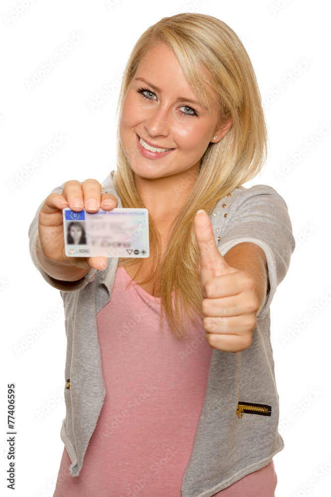Young woman showing her driver's license Stock-Foto | Adobe Stock