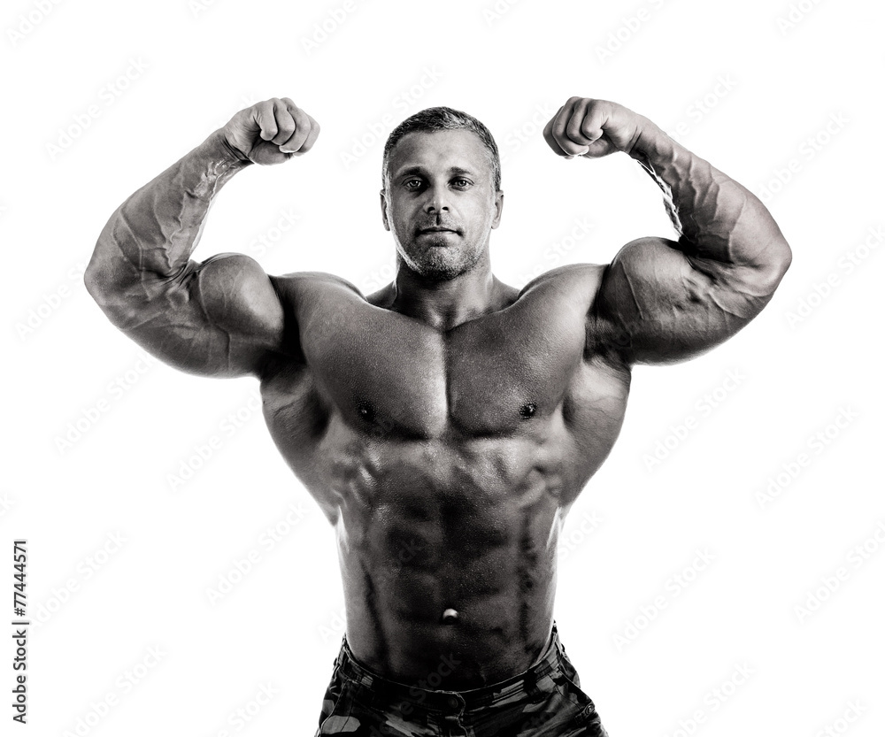 Bodybuilder posing Stock Photo | Adobe Stock