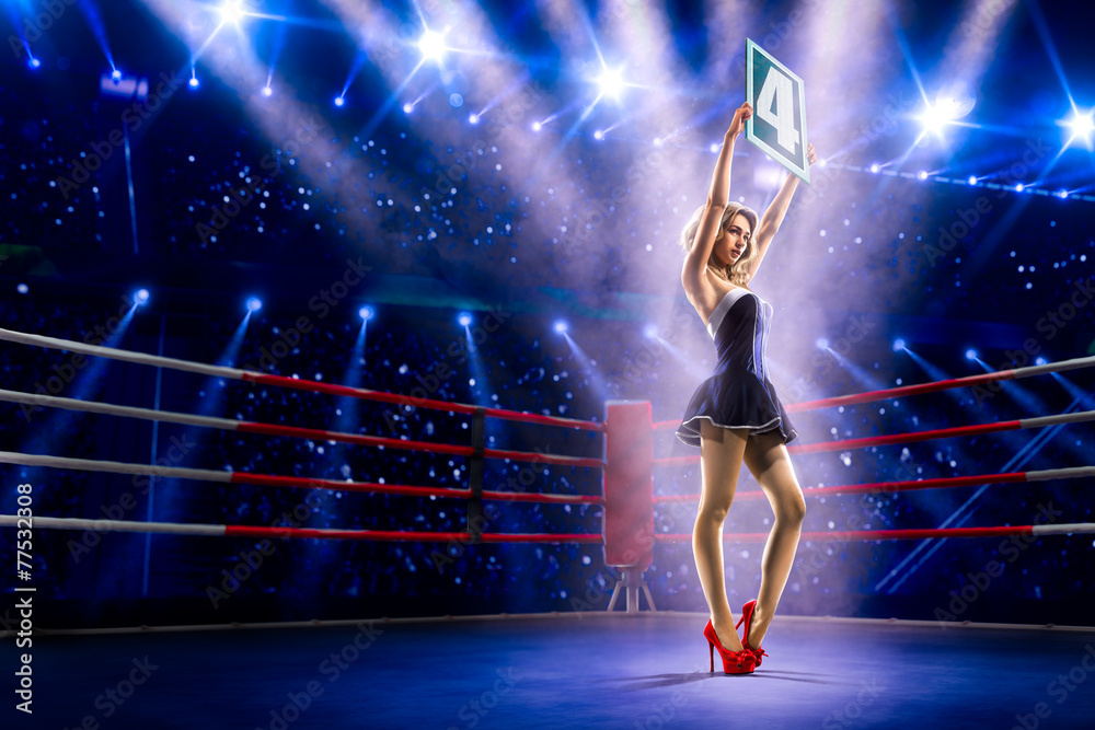 Boxing ring girl is holding the number Stock Photo | Adobe Stock