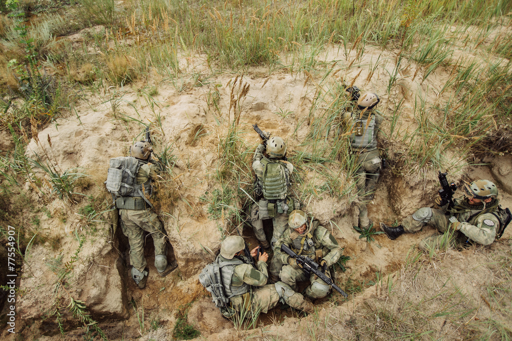group of soldiers hiding in the trenches and firing Stock Photo | Adobe ...