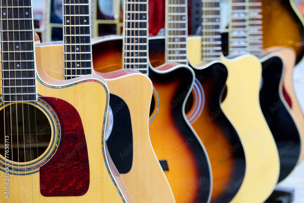 Guitars in the store background Stock Photo | Adobe Stock