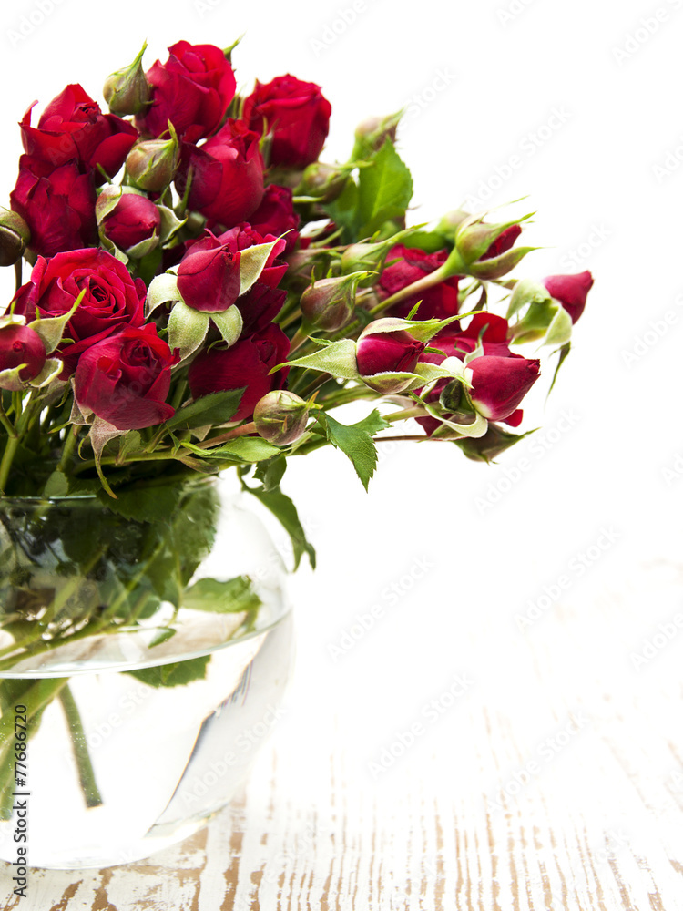 Red roses in vase Stock Photo | Adobe Stock