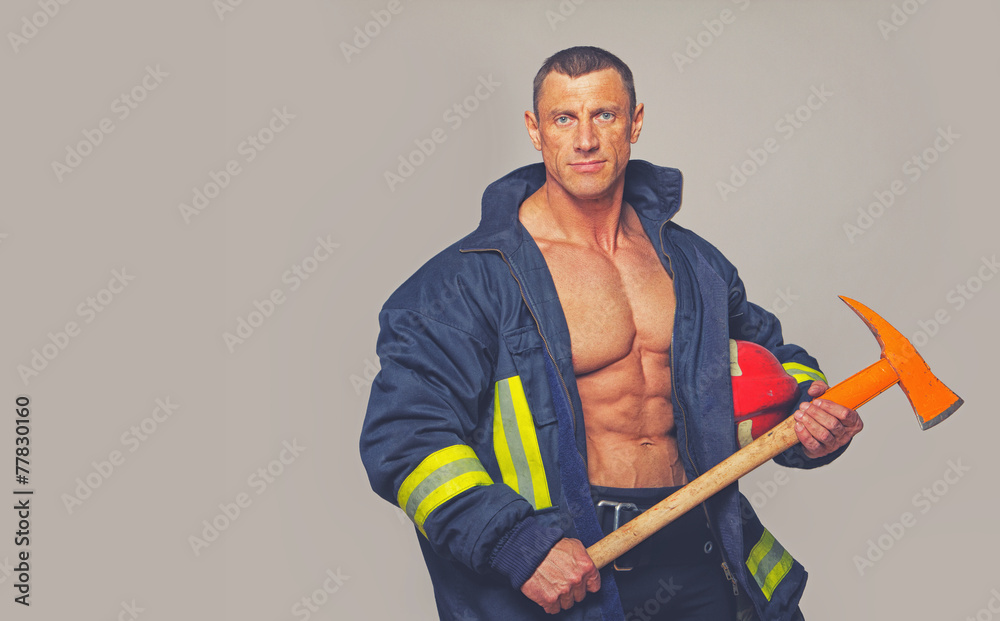 Portrait of muscle man in fireman uniform Stock-Foto | Adobe Stock