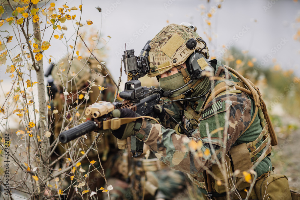 soldier with a rifle aiming at a target Stock Photo | Adobe Stock