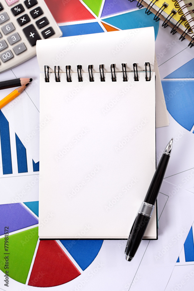 Financial accounting background with blank notepad to do list charts ...