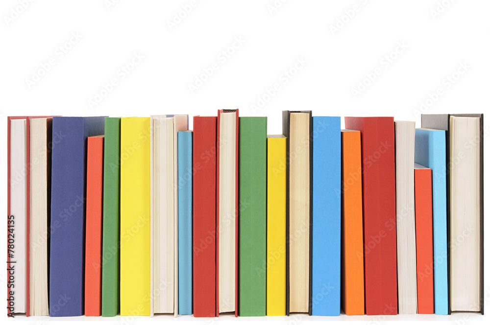 Small row line of colorful books spine facing library collection ...