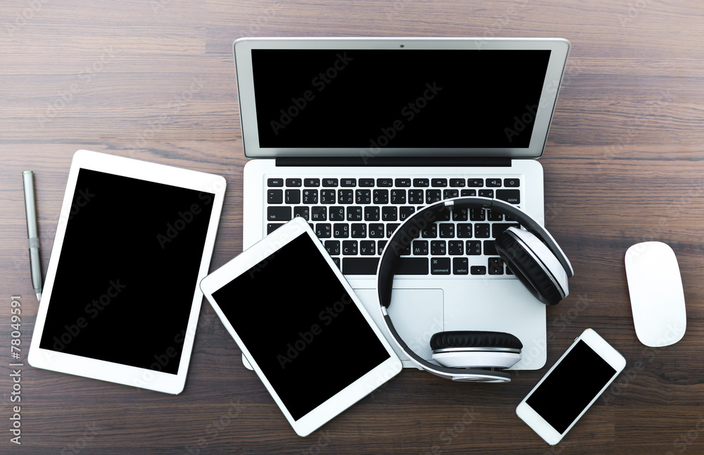 laptop with tablet and smart phone on table Stock Photo | Adobe Stock