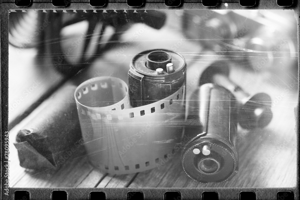 Old film stylized photo of rolled up film, cassette and retro ca Stock ...