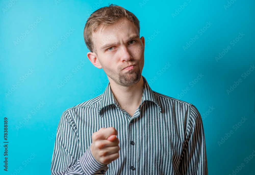 Closeup portrait of young man giving thumb, finger fig gesture that you ...
