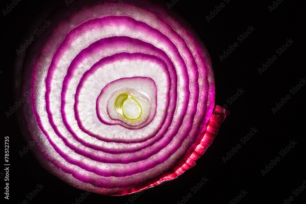 Cross section slice of red onion against dark background Stock Photo ...