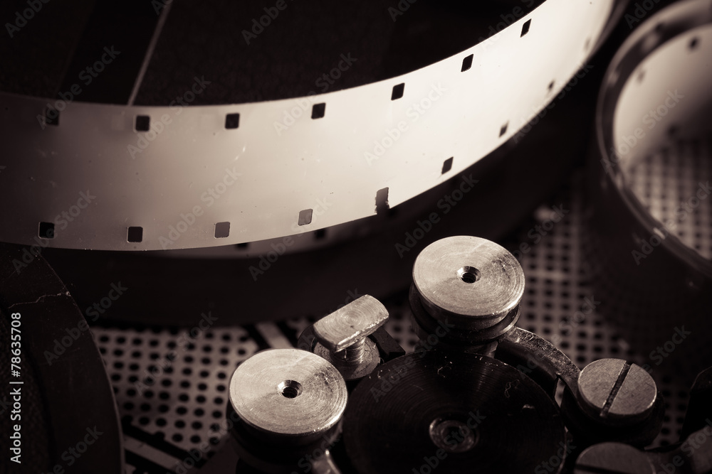 Film reel inside old-fashioned retro movie camera mechanism Stock Photo ...