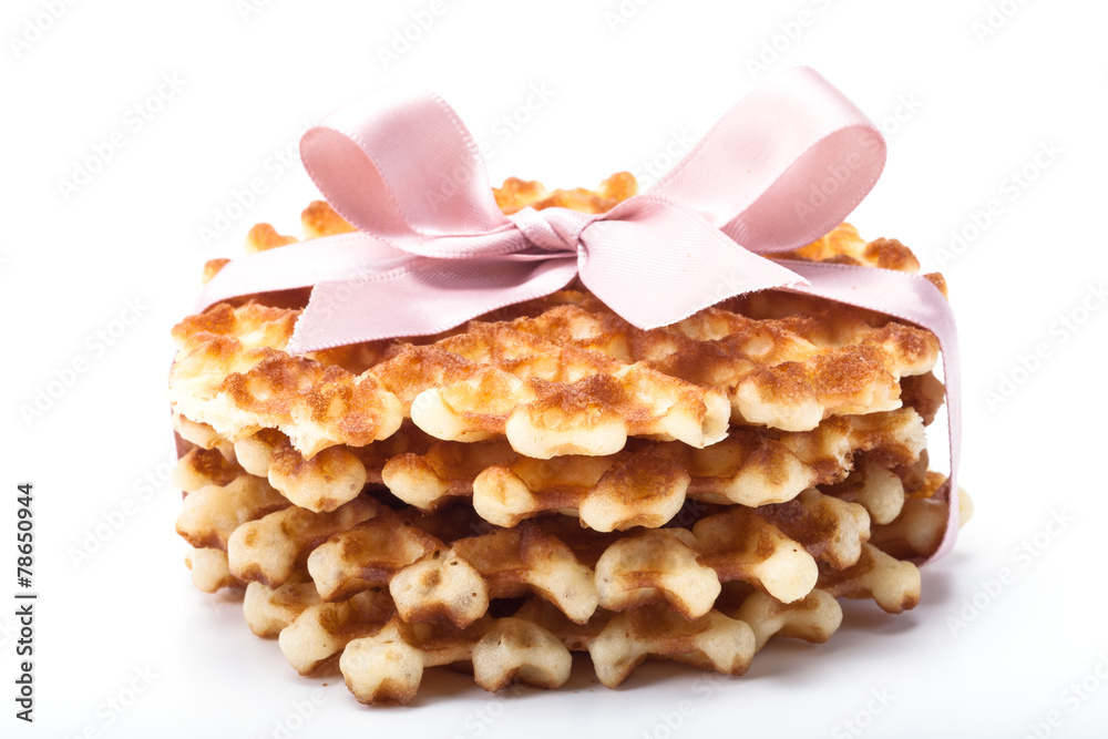 Stack of round waffles on white background with pink ribbon Stock Photo ...