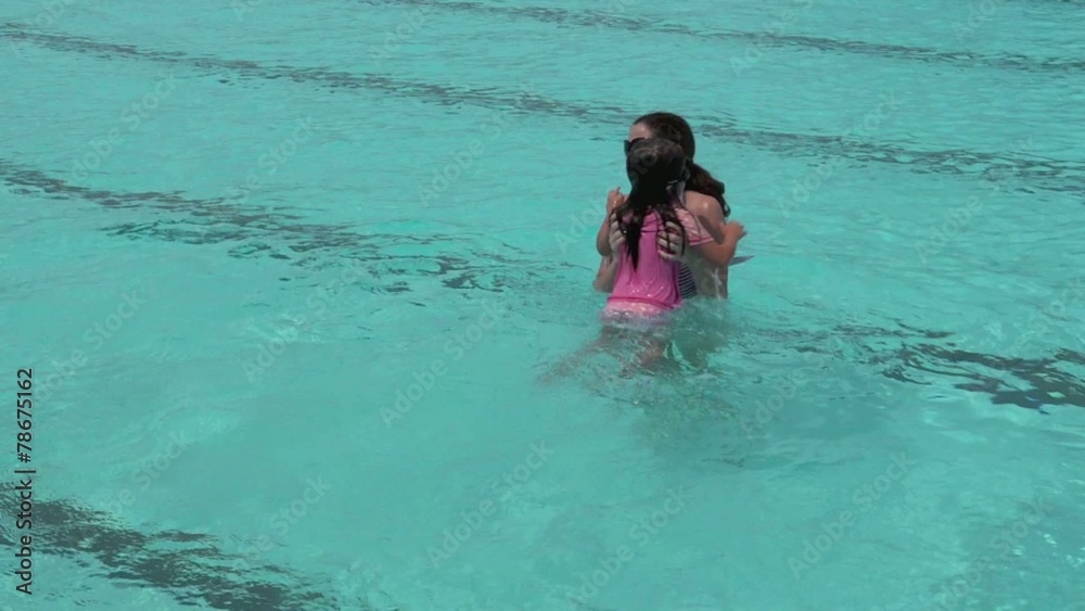 Girl child jumps into swiming pool Stock Video | Adobe Stock