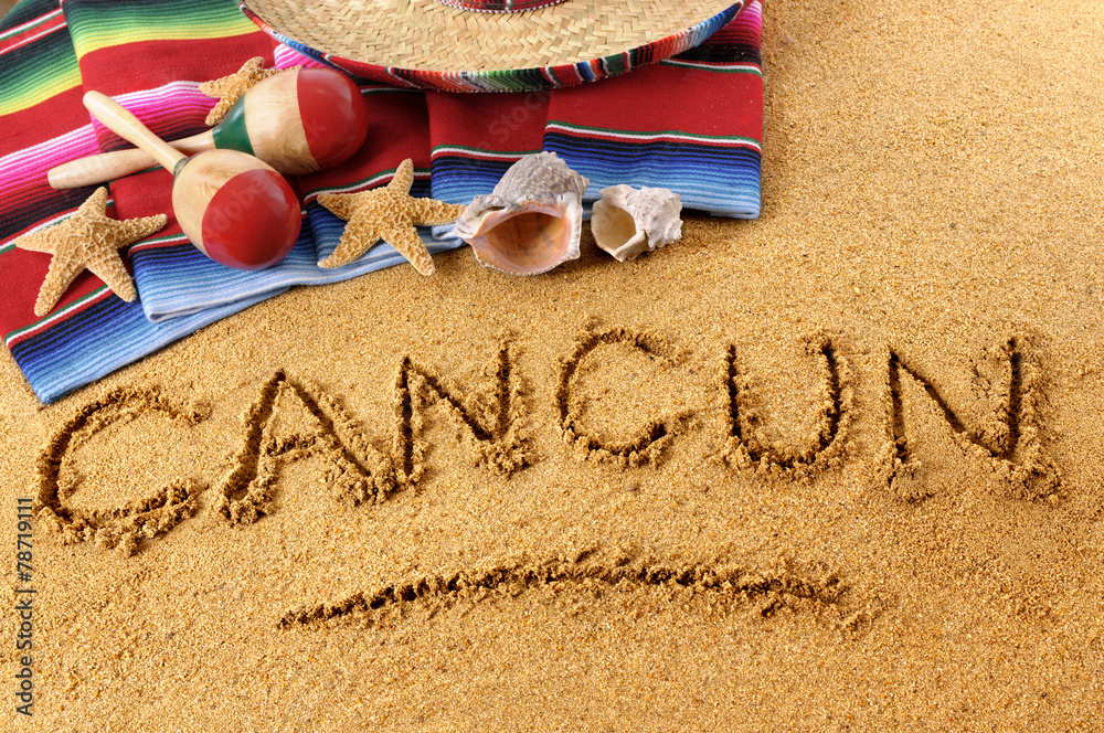 Cancun beach writing word written in sand on a mexico beach with ...