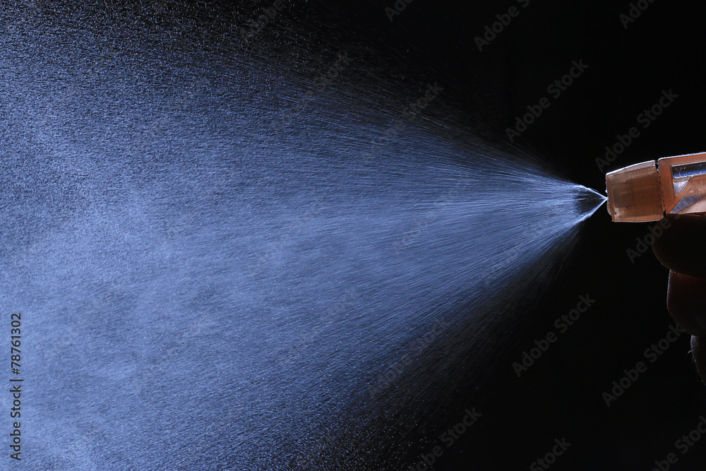 spray from the atomizer spray on black background overlay Stock Photo ...