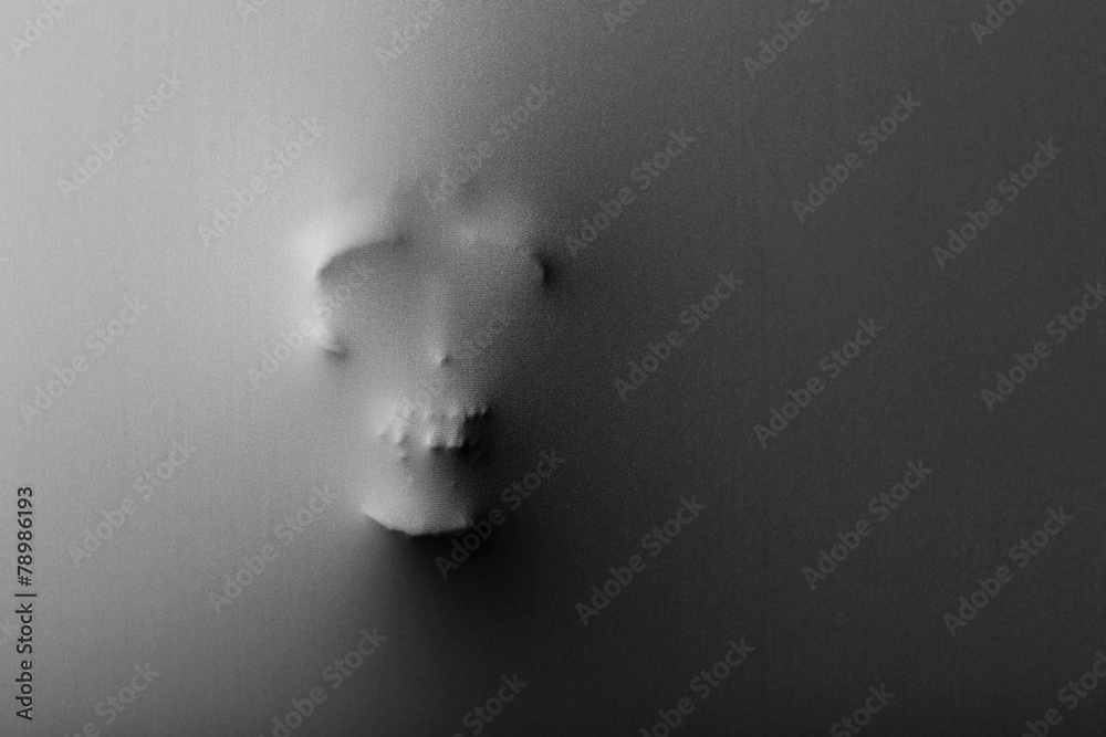 Skull pressing through fabric as horror background Stock Photo | Adobe ...