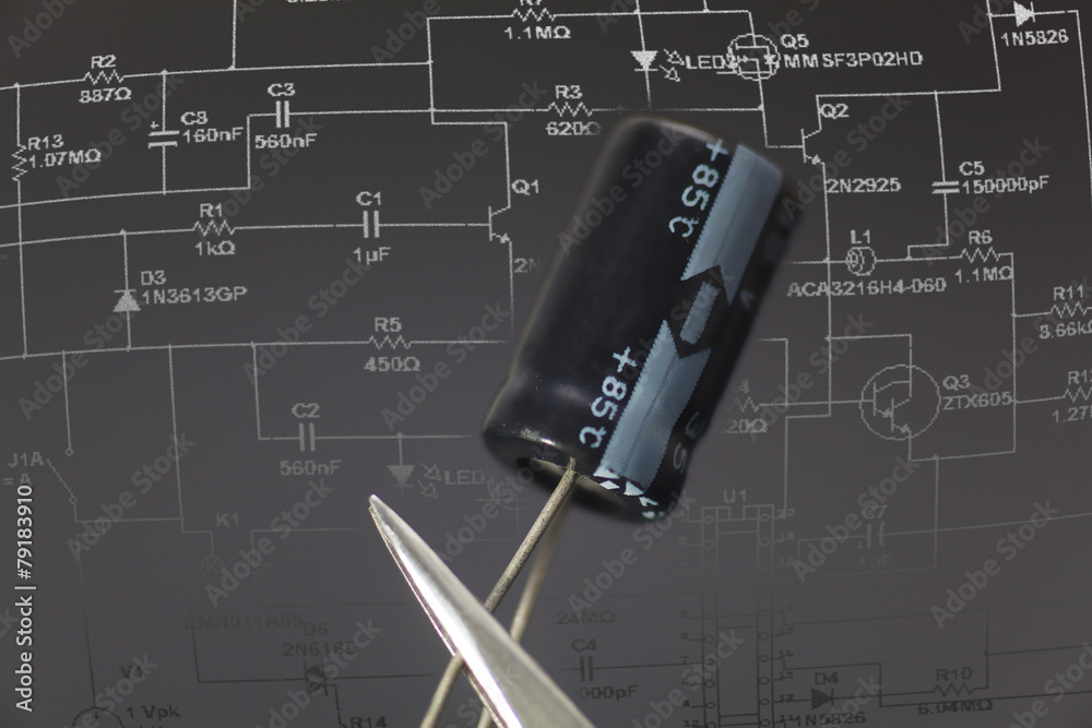 Electronic capacitor in black background Stock Photo | Adobe Stock