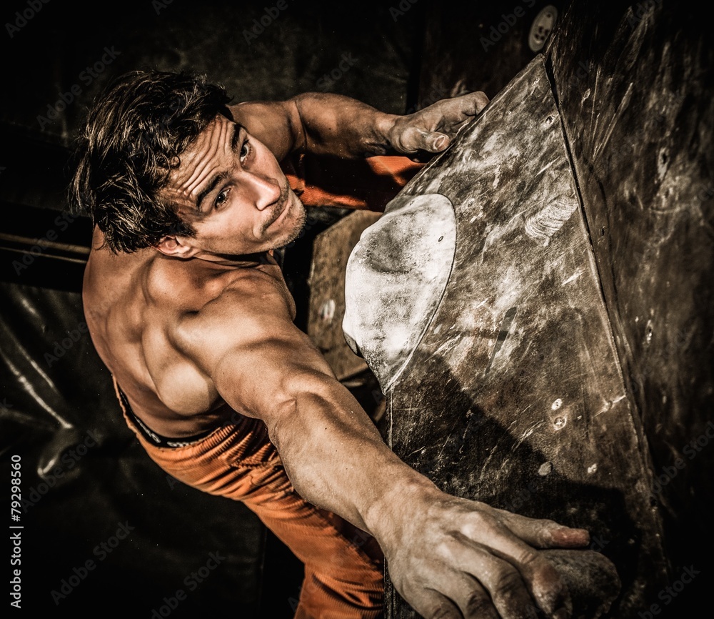 Muscular man practicing rock-climbing Stock Photo | Adobe Stock