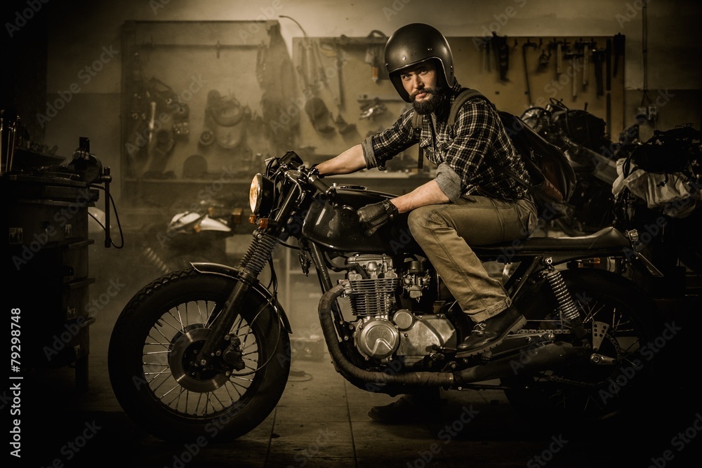 Rider and his vintage style cafe-racer motorcycle Stock Photo | Adobe Stock