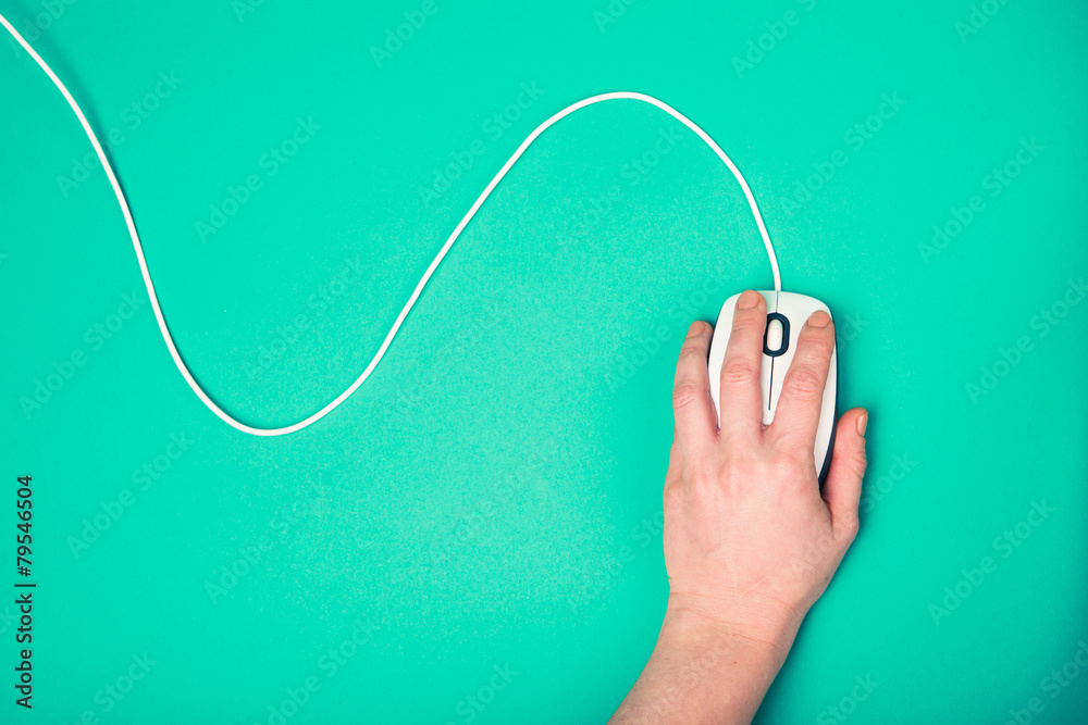hand on computer mouse, emerald background Stock Photo | Adobe Stock
