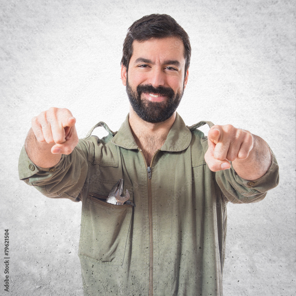 Mechanic pointing to the front Stock Photo | Adobe Stock