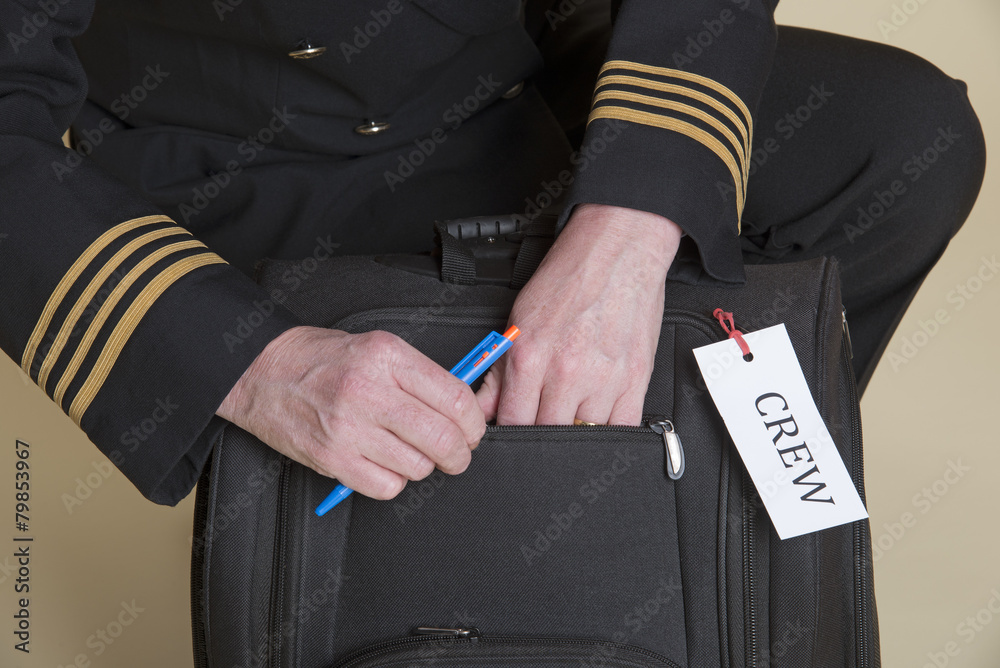 Female airline pilot checking contents of her flight bag Stock Photo ... Female airline pilot checking contents of her flight bag Stock Photo ...