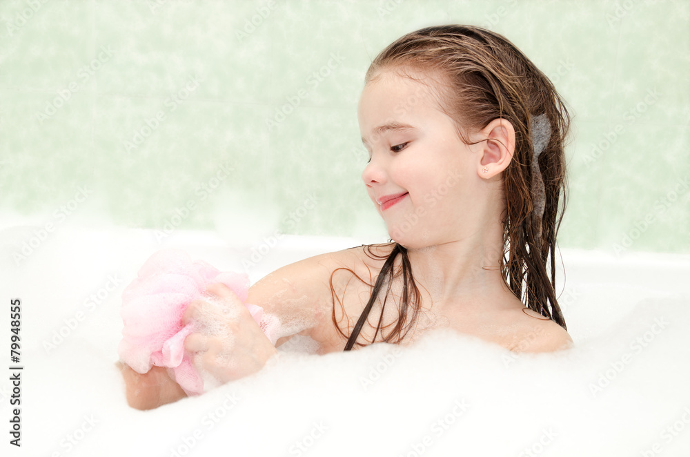 Smiling little girl washing in bath Stock Photo | Adobe Stock