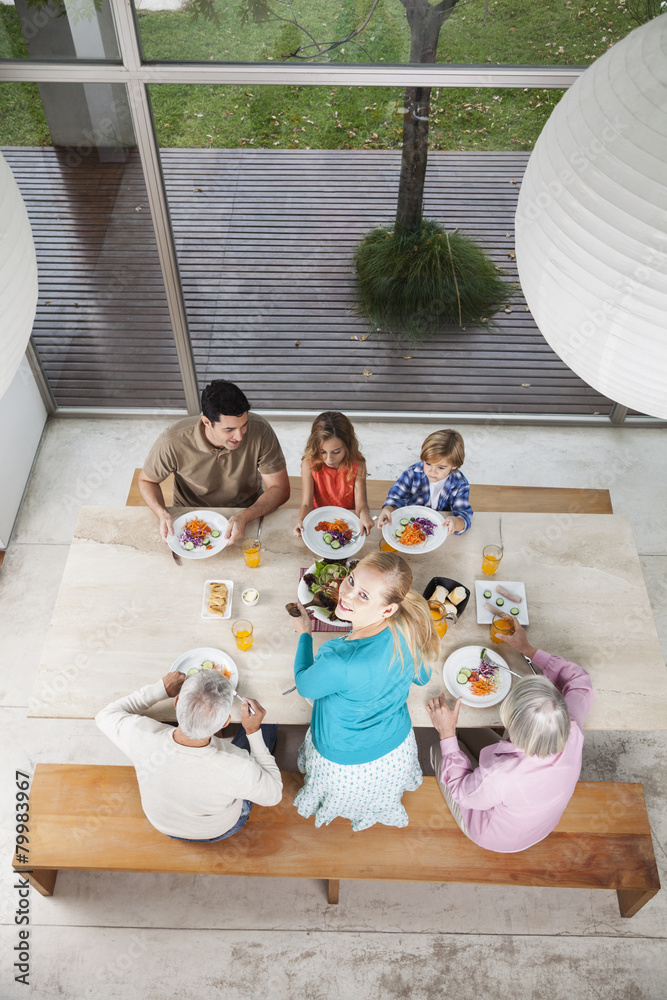 Extended family with salad and juice at dining table Stock Photo ...