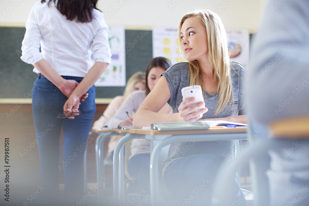 Female student in classroom cheating during an exam Stock Photo | Adobe ...