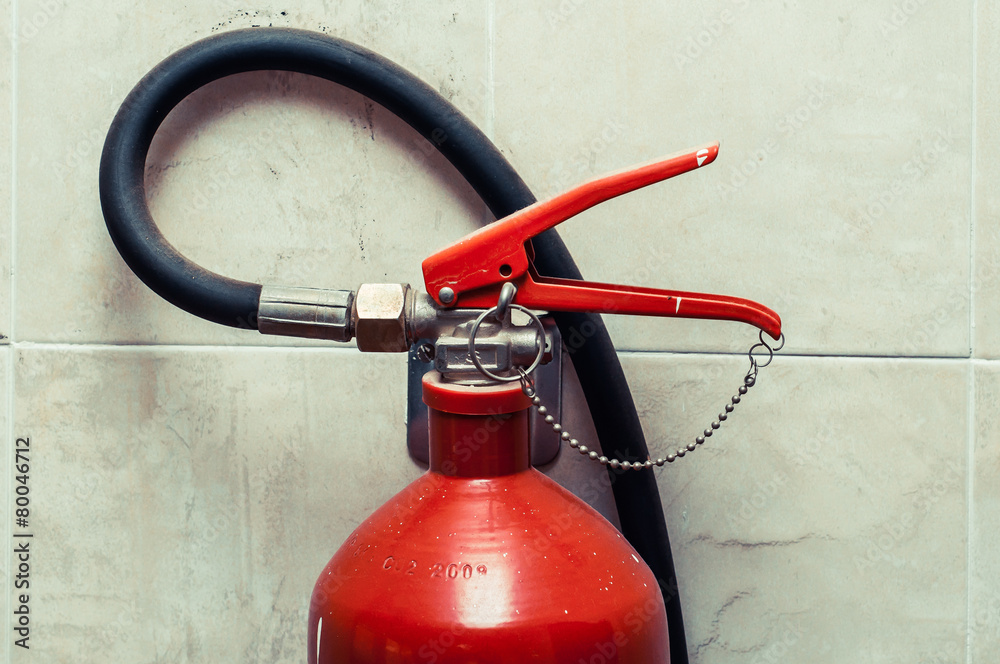 Trigger fire extinguisher Stock Photo | Adobe Stock