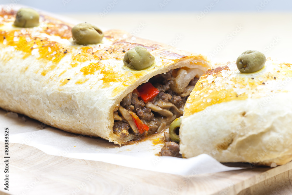 puff roly-poly filled with minced meat and green olives Stock Photo ...