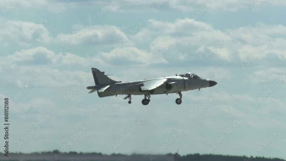 Hawker Harrier Jump Jet hovers and lands vertically on runway into its ...