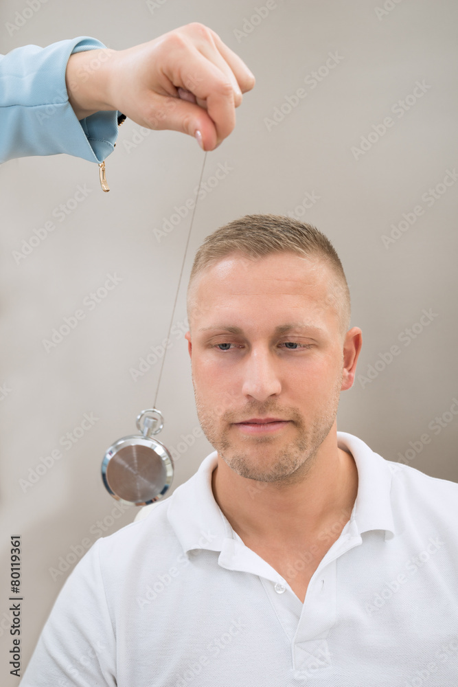 Psychiatrist Hypnotizing Patient With Pendulum Stock Photo | Adobe Stock