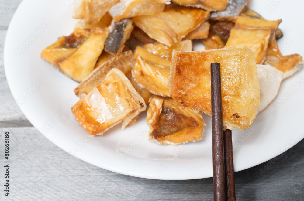 Vietnamese deep fried dried Pangasius kunyit fish, ca dua kho c Stock ...