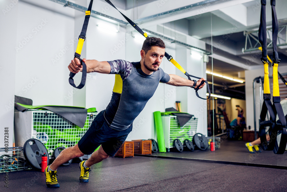 Crossfit instructor at the gym doing TRX Excersise Stock Photo | Adobe ...