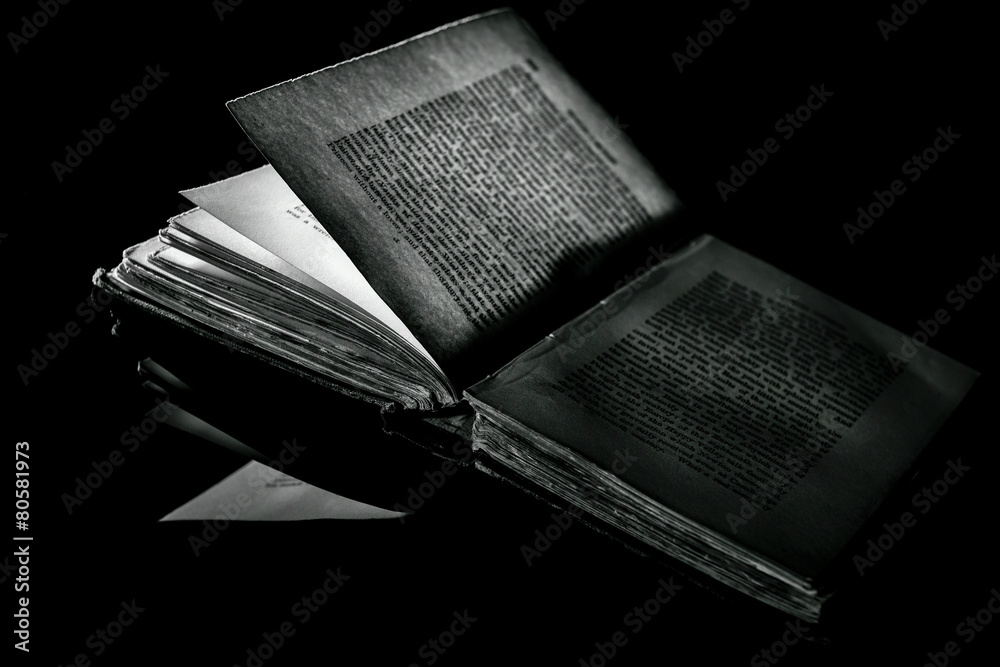 High contrast b&w image of an old book on black surface foto de Stock ...