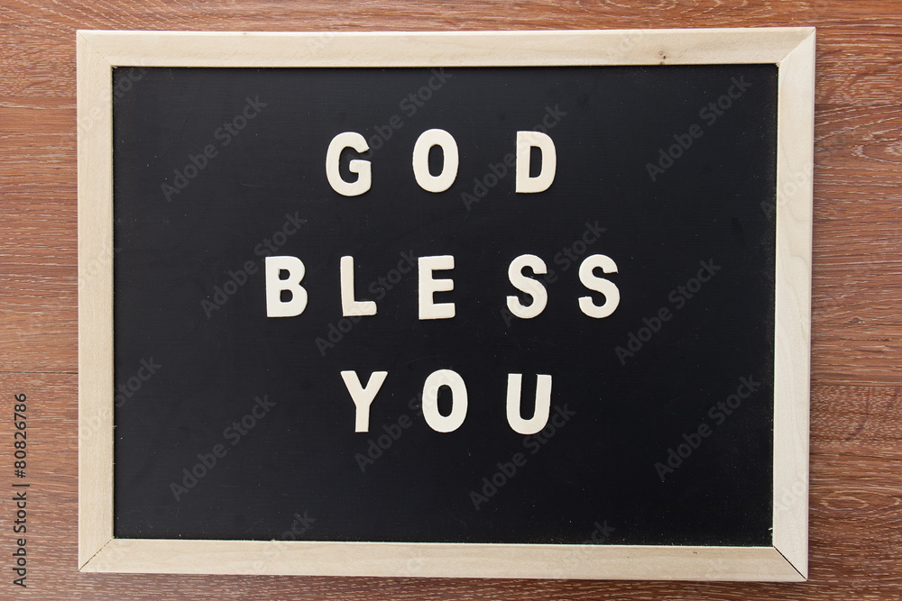 wood letters text form bible "GOD bless you" on chalk board. Stock ...